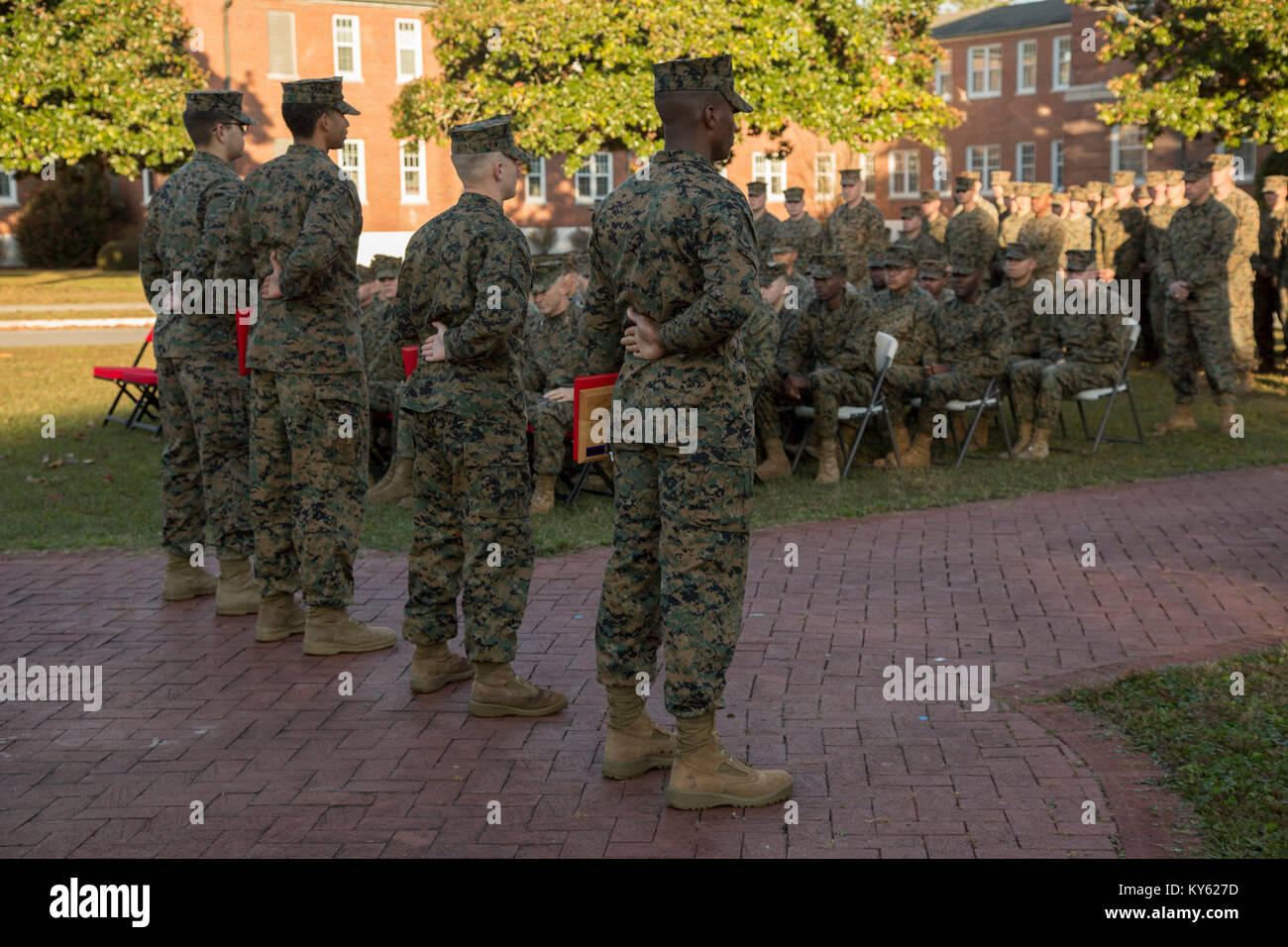 U.S. Marines and Sailors with 2nd Marine Division stand at parade rest ...