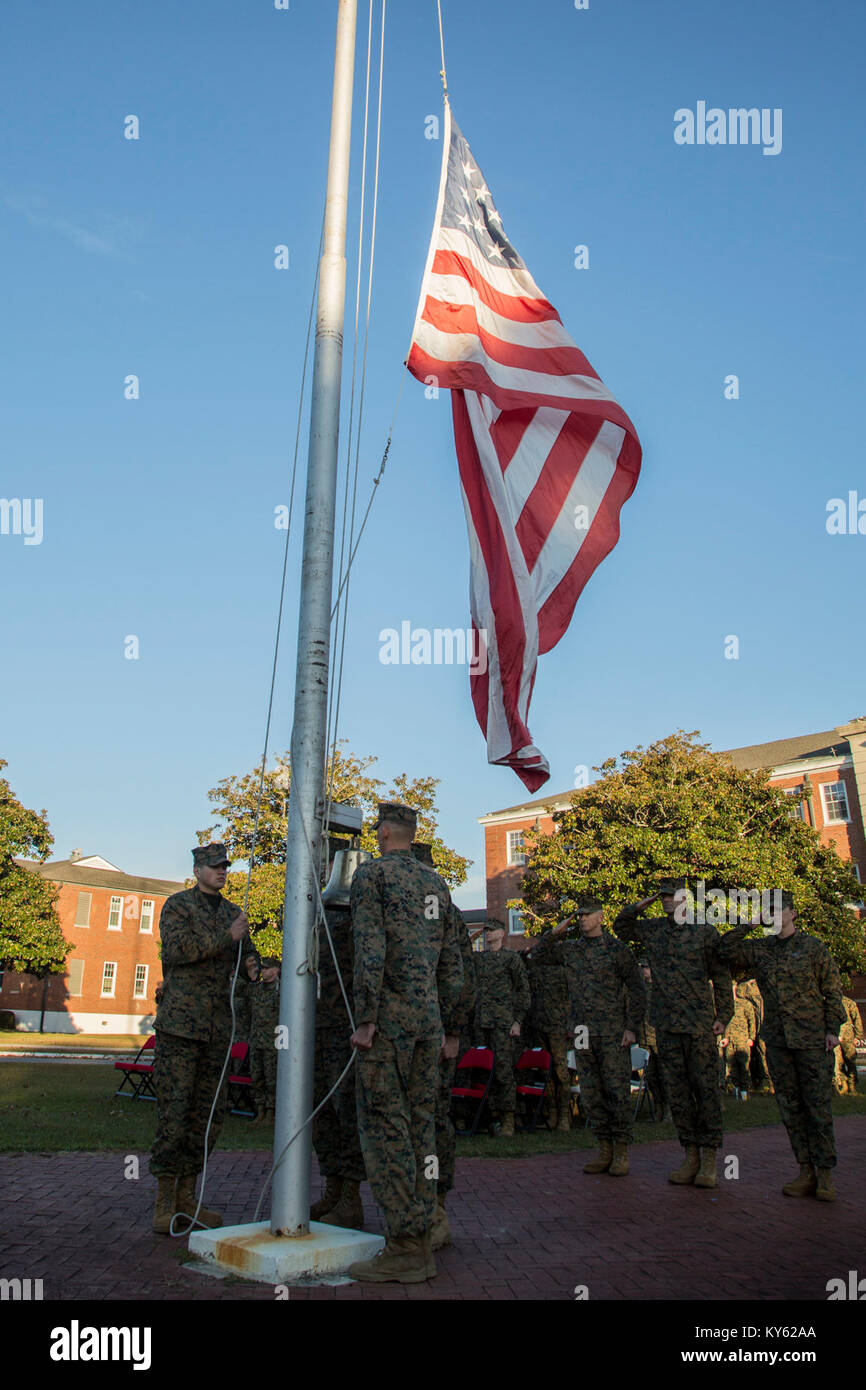 U.S. Marines with the 2nd Marine Division color guard raise the colors ...