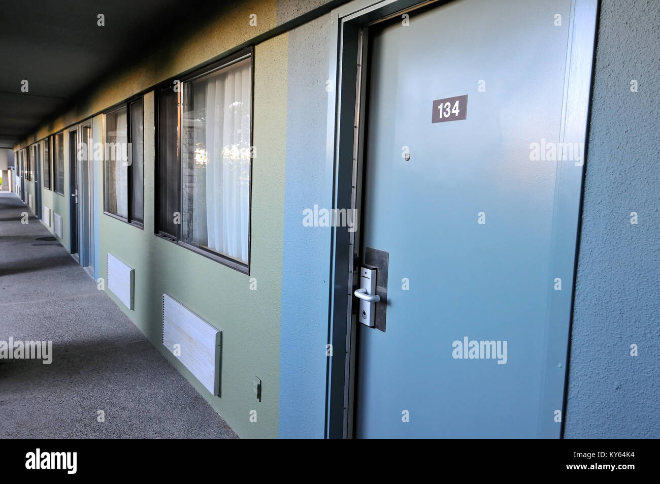 Exterior view of hotel room showing doors and windows Stock Photo - Alamy