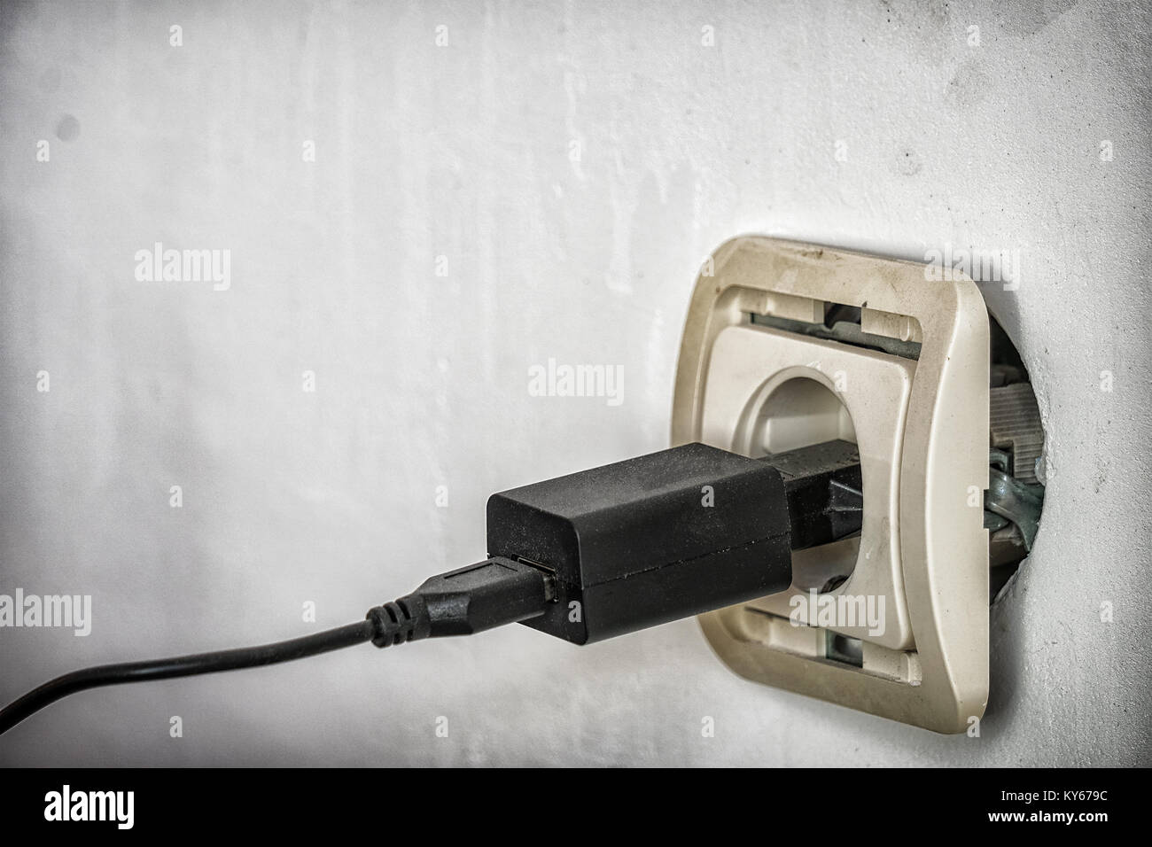 Electrical socket outlet falling out of wall Stock Photo - Alamy