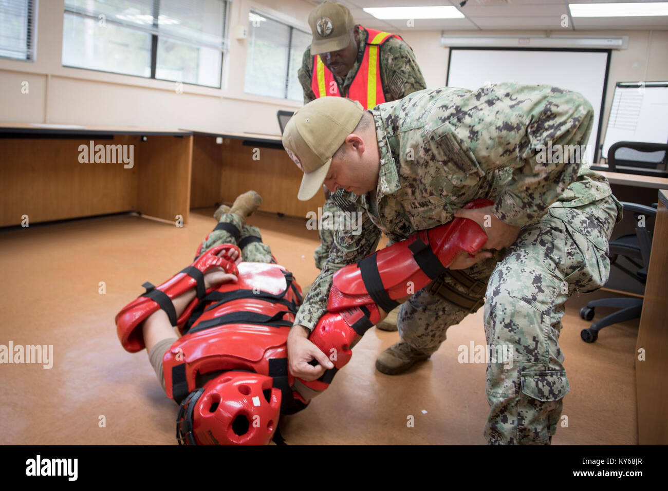 U.S. Navy Master at Arms 1st Class Jason C. Eisiminger, assigned to ...