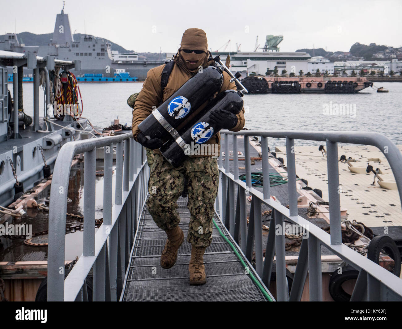 U.S. Navy Senior Chief Construction Electrician Adam Winters, assigned ...