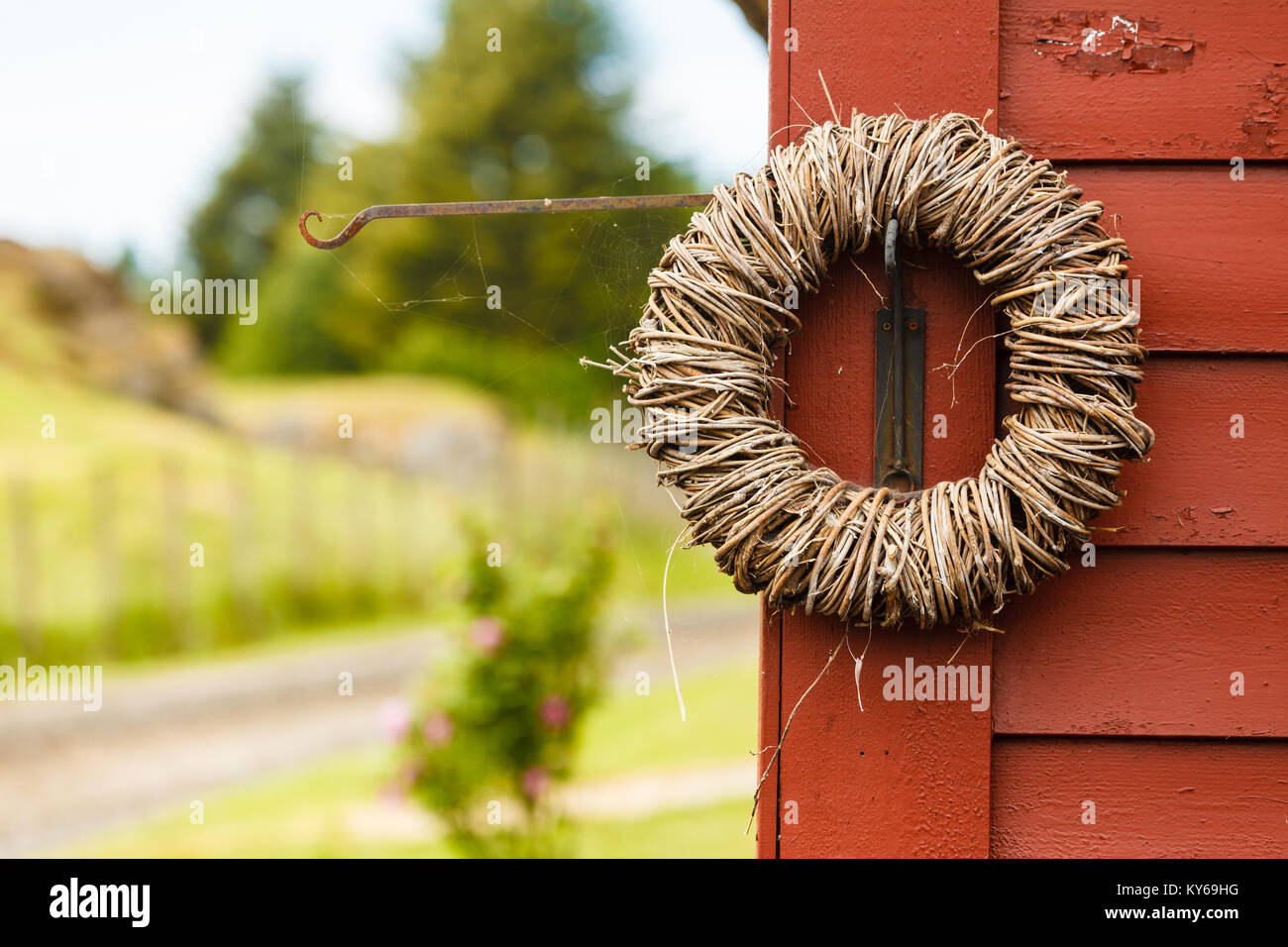 Handmade decorative objects concept. Rounded wicker decoration hanging ...