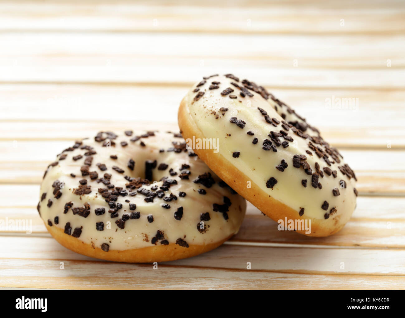 sweet donuts with sugar and chocolate colored glaze Stock Photo - Alamy