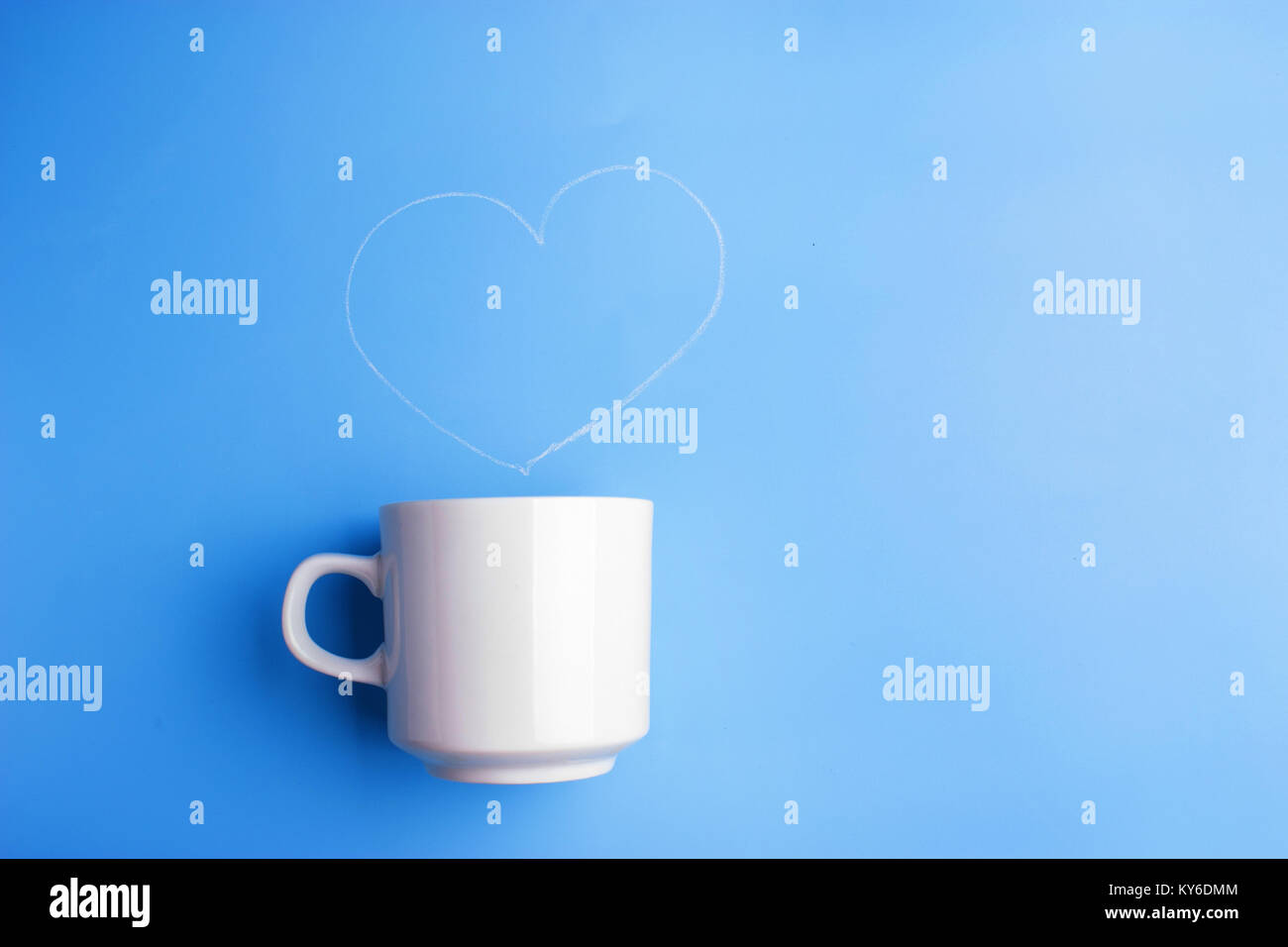 white cup on blue background with hearts Stock Photo - Alamy