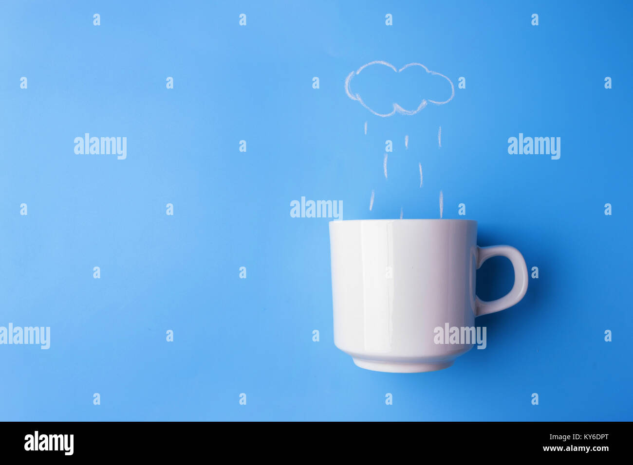 rain pouring in coffee cup on blue background Stock Photo - Alamy