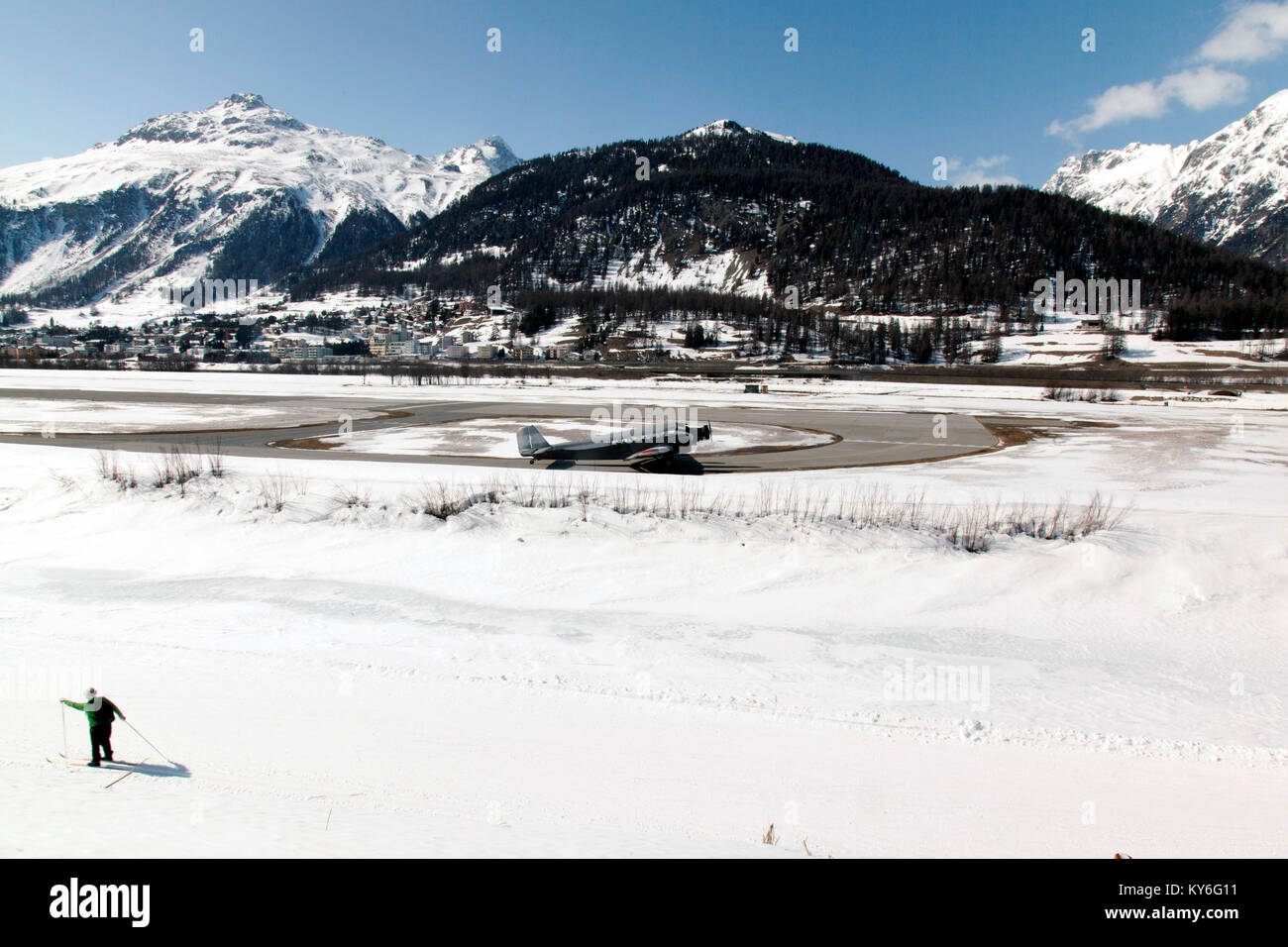 A view of a village in St Moritz, snow covered landscape and mountain ...