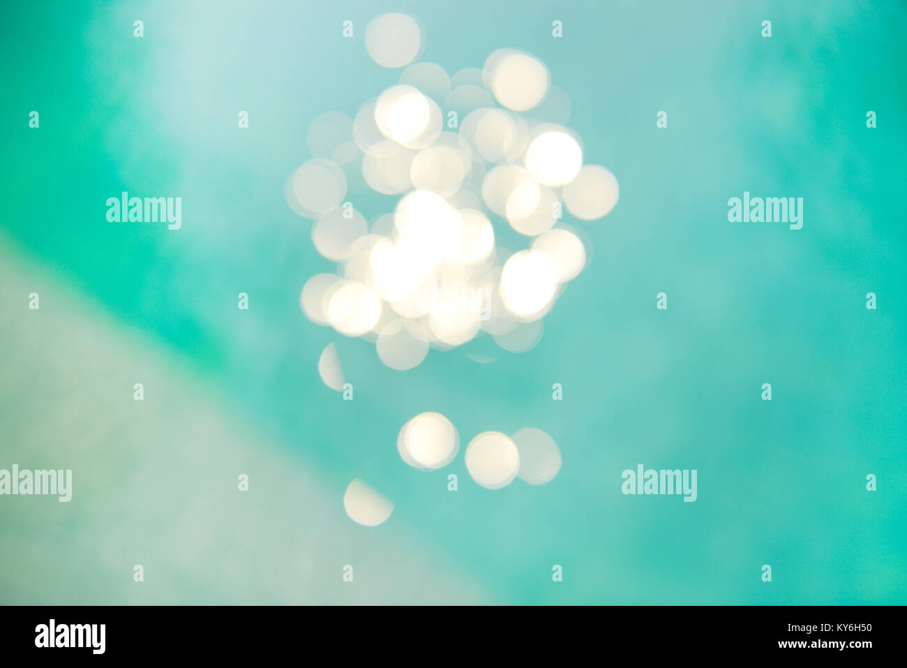 Soft focus bokeh light effects over a rippled, blue water background in the pool Stock Photo - Alamy