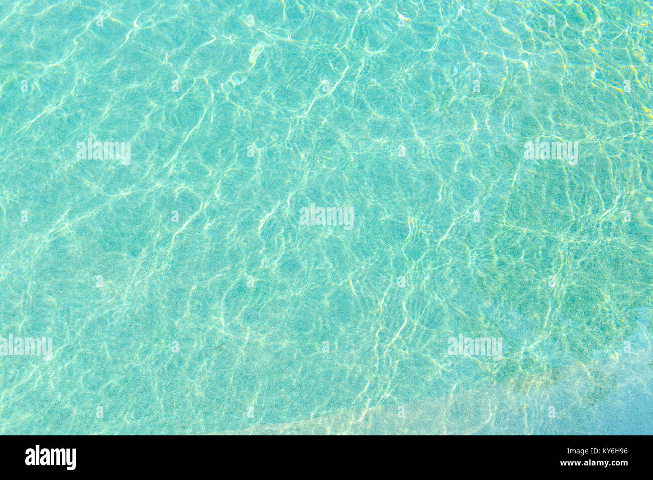 Swimming pool blue water with a wave and sunlight reflection effect ...