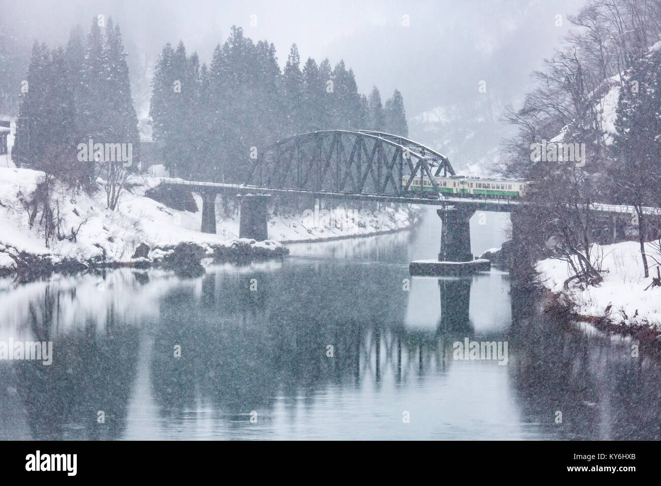 Train in Winter landscape snow on bridge Stock Photo - Alamy