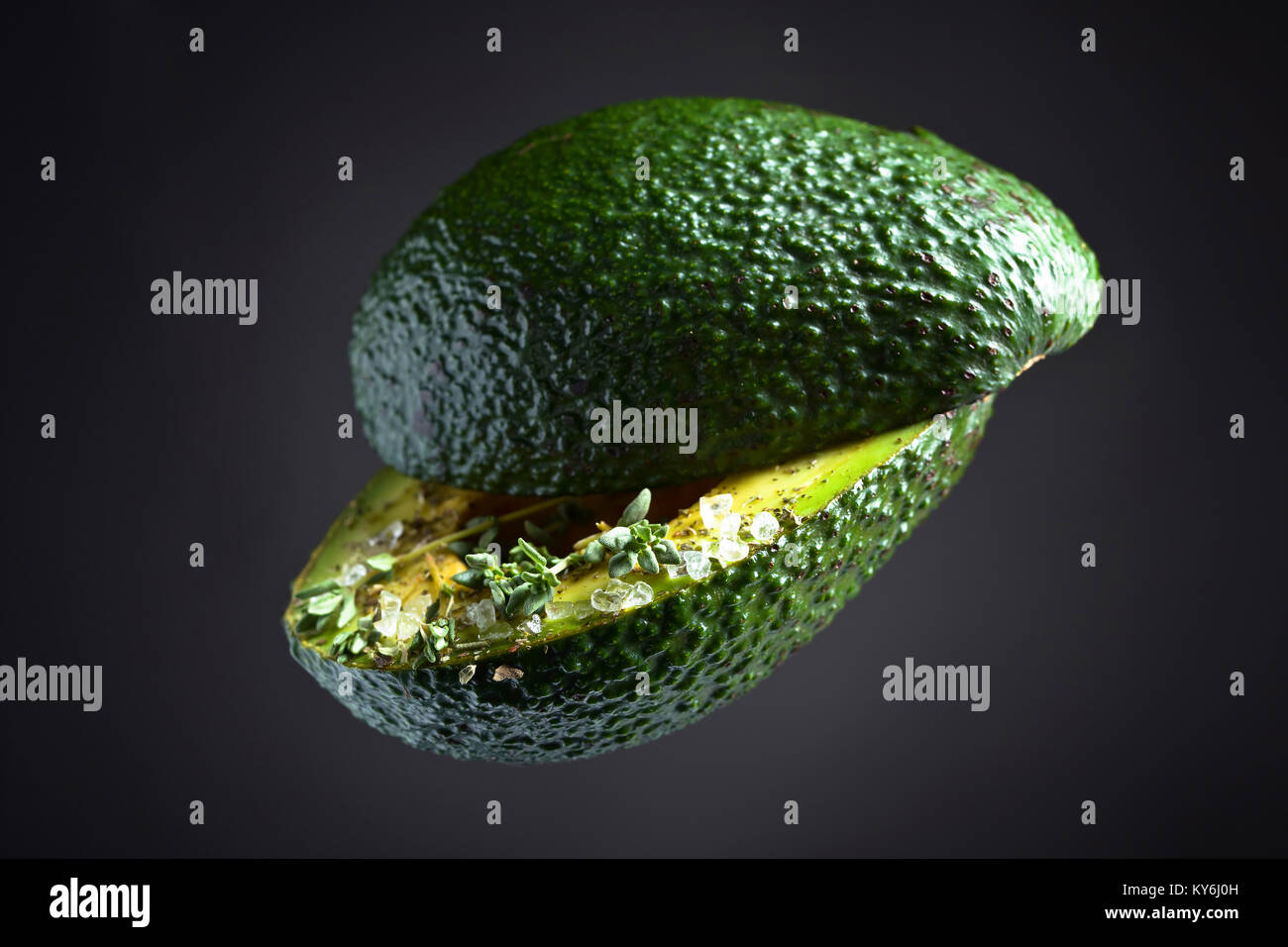 Avocado with spices , thyme and sea salt Stock Photo - Alamy