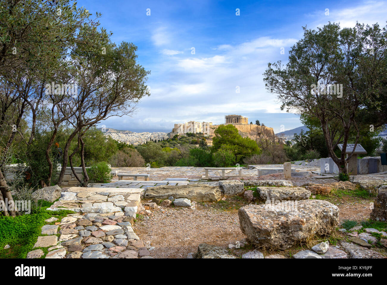 Acropolis with Parthenon. View through a frame of green plants, trees ...