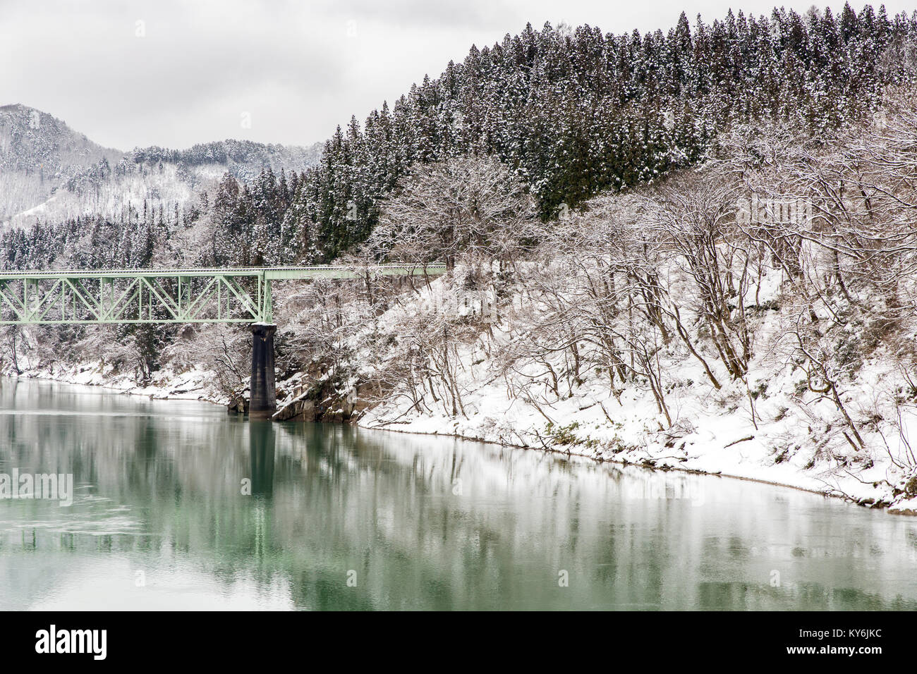 Train in Winter landscape snow on bridge Stock Photo - Alamy