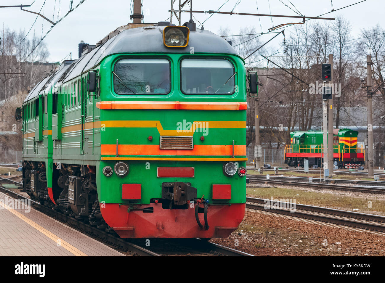 Green diesel cargo locomotive. Freight train in action Stock Photo - Alamy