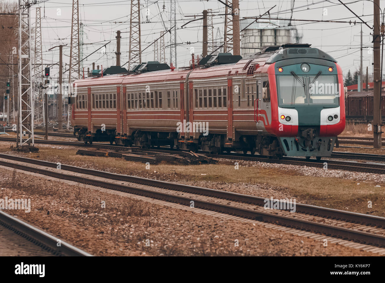 Red diesel passenger train driving at the old terminal Stock Photo - Alamy