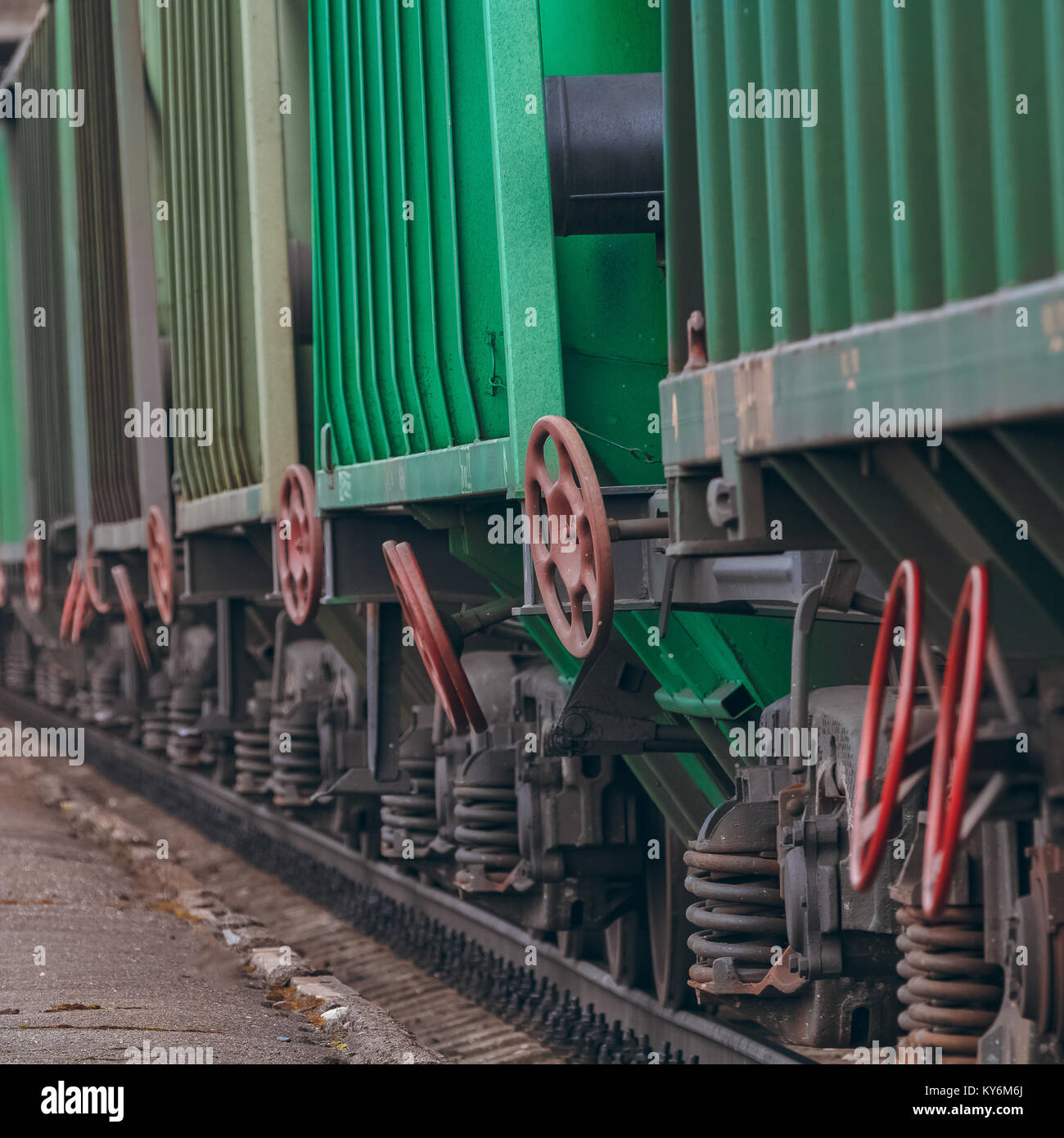 Green cargo wagons. Freight train in action Stock Photo - Alamy