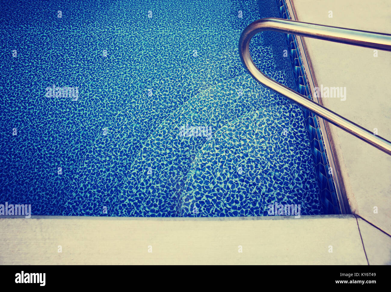 a local public pool without any people in it just showing the steps and ...