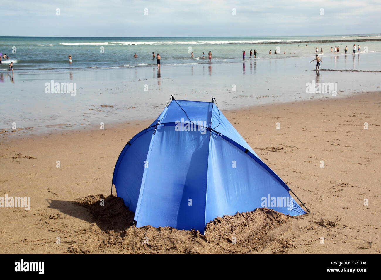 Blue tent on the sand beach in Argentina Stock Photo - Alamy