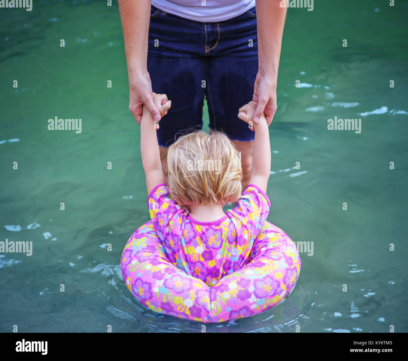 Child floating water safety hi-res stock photography and images - Alamy