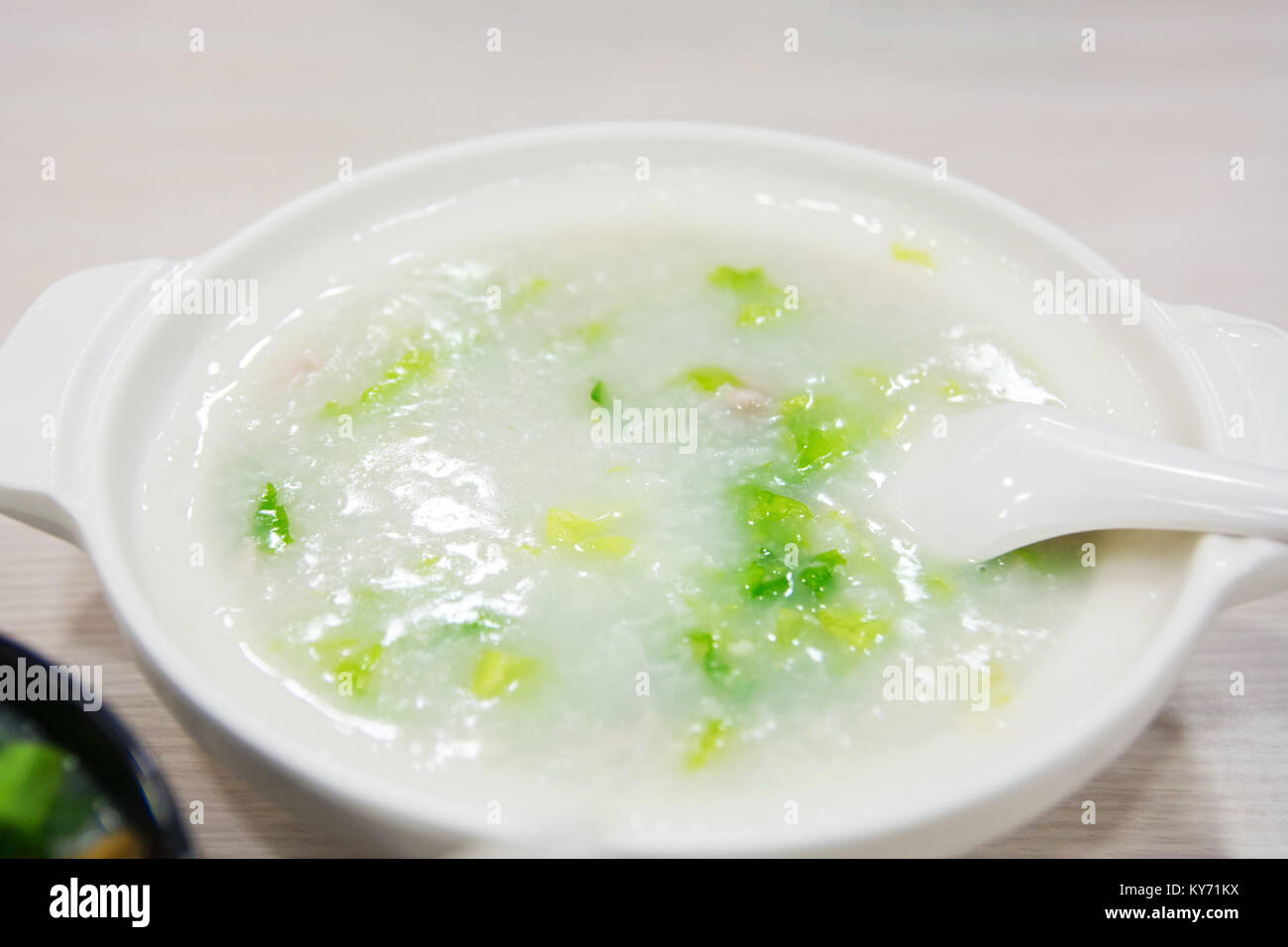 Chinese fish and rice porridge in a restaurant Stock Photo - Alamy