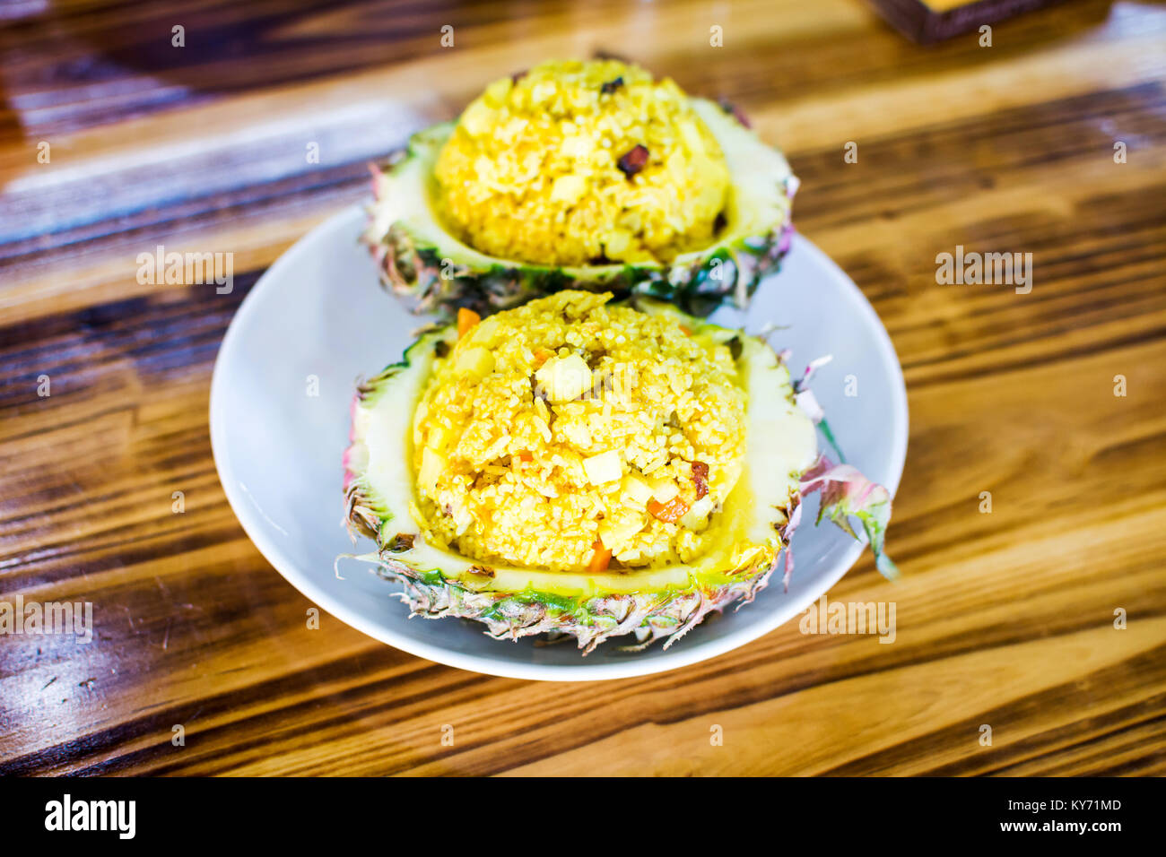 Pineapple fry rice served on natural pineapple shell Stock Photo - Alamy