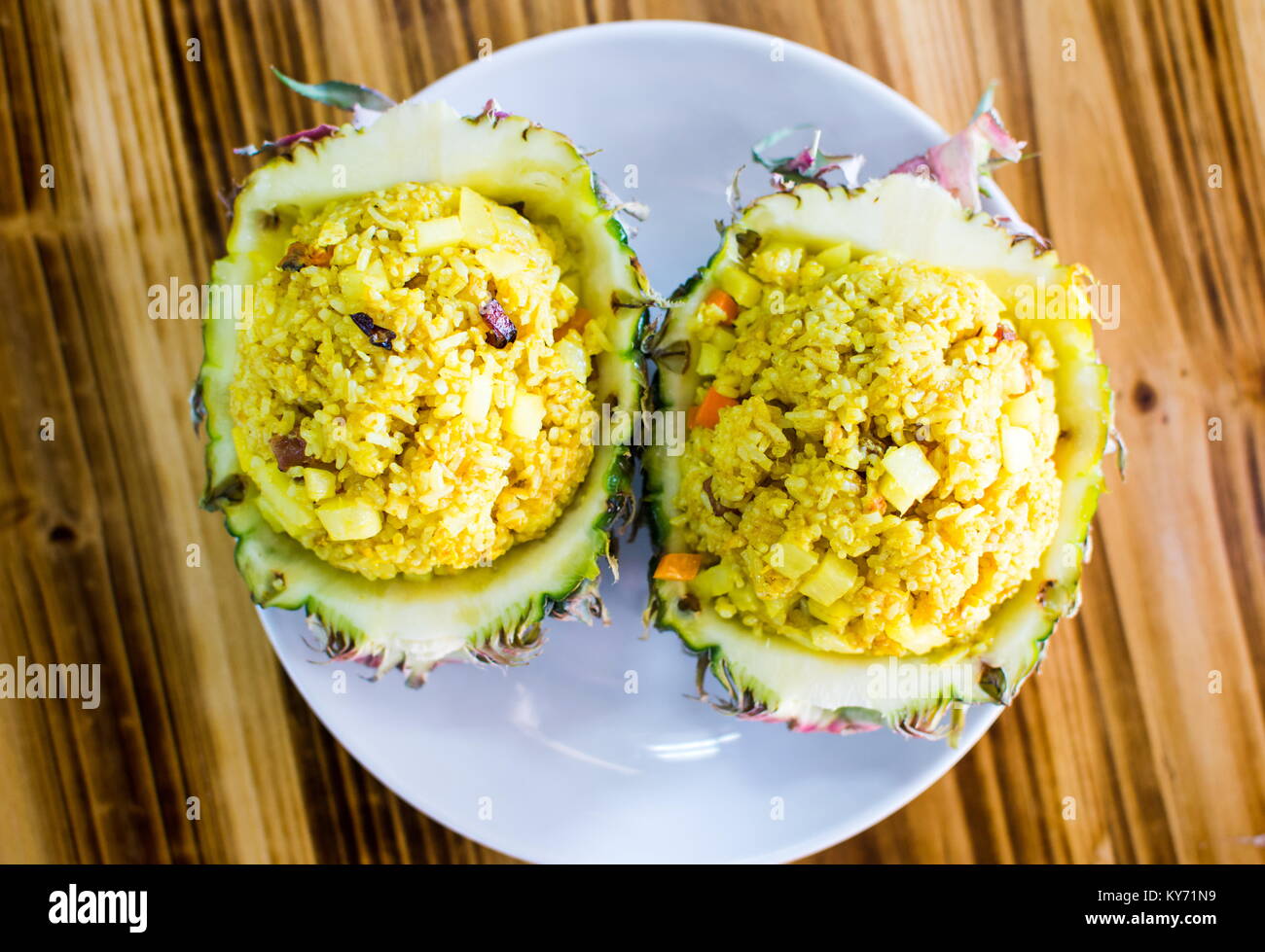 Pineapple fry rice served on natural pineapple shell Stock Photo - Alamy