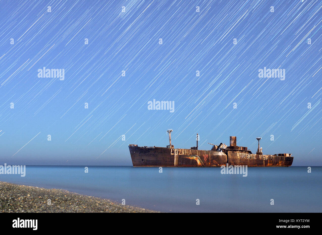 Beautiful star trails with a greek shipwreck Evangelia on the shore of ...