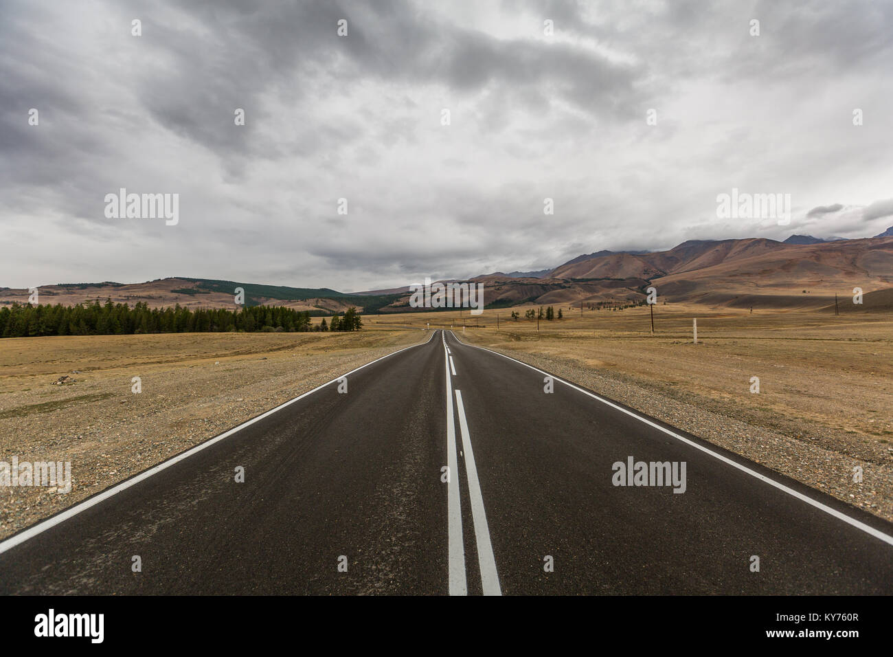 Straight endless empty road Stock Photo - Alamy