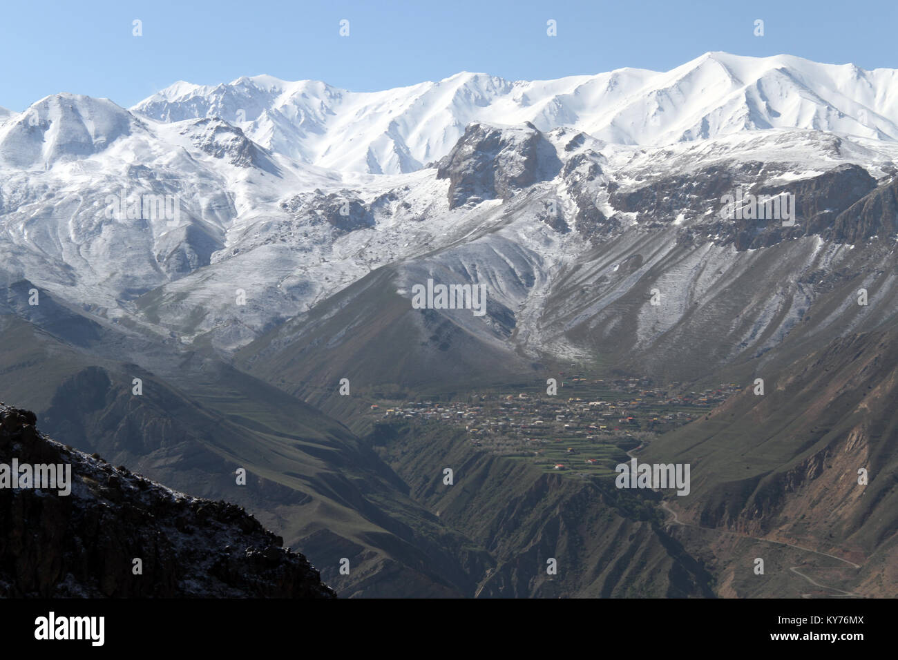 Snow mountain with village in Iran Stock Photo - Alamy