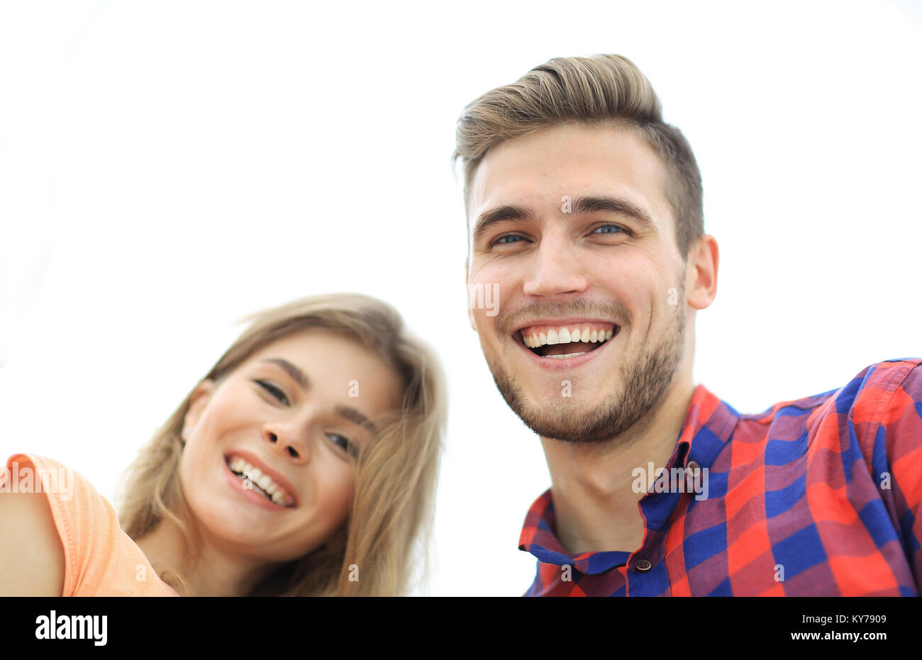 closeup of three young people smiling on white background Stock Photo ...