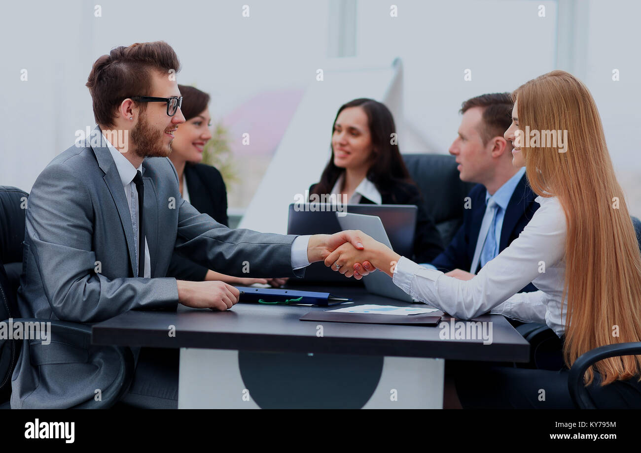 Two professional business people shaking hands Stock Photo - Alamy