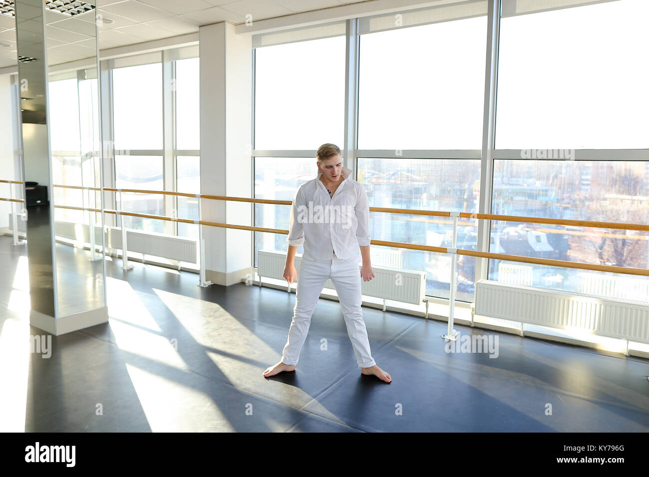 Young person jumping and dancing in street style way barefoot . Guy ...