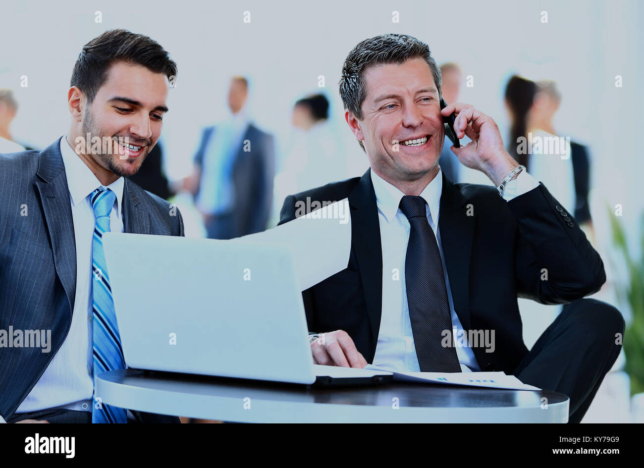 Business men discussing together in an office Stock Photo - Alamy