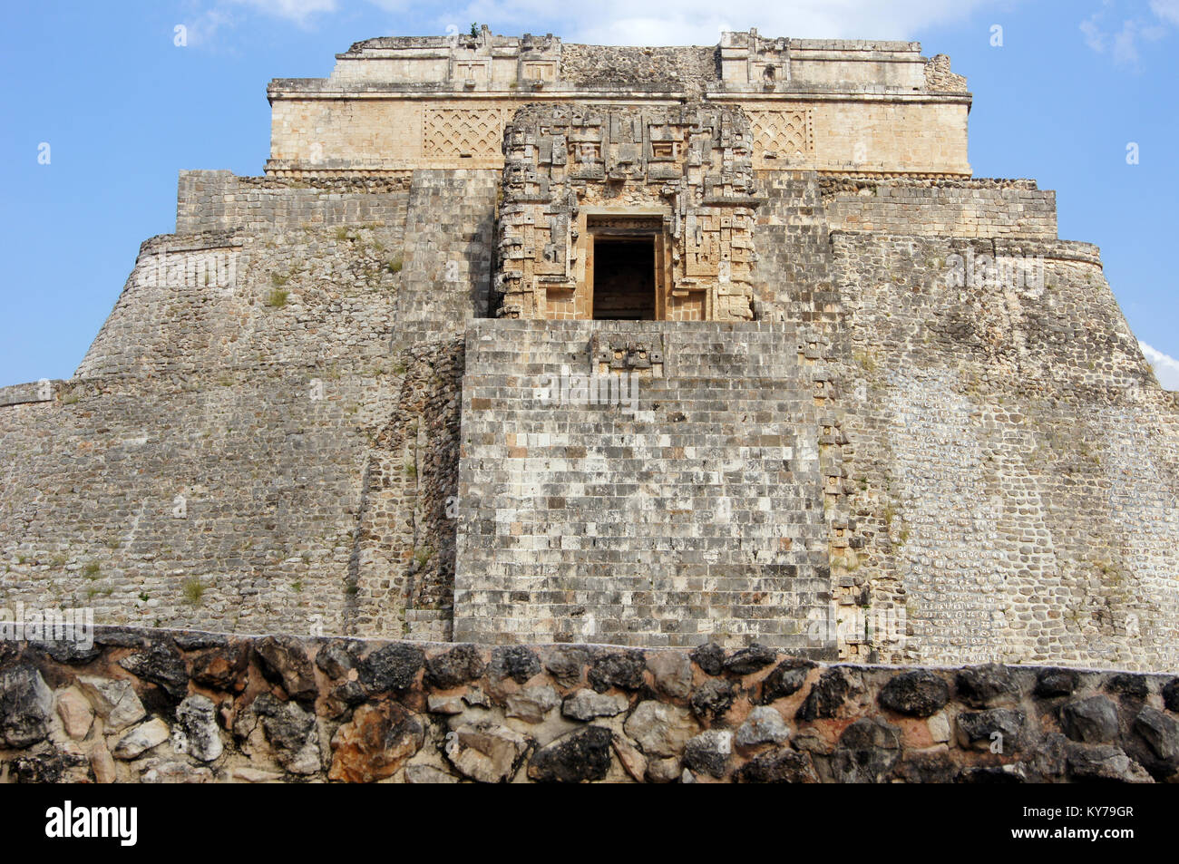Pyramid and stone wall in Uxmal, Mexico Stock Photo - Alamy