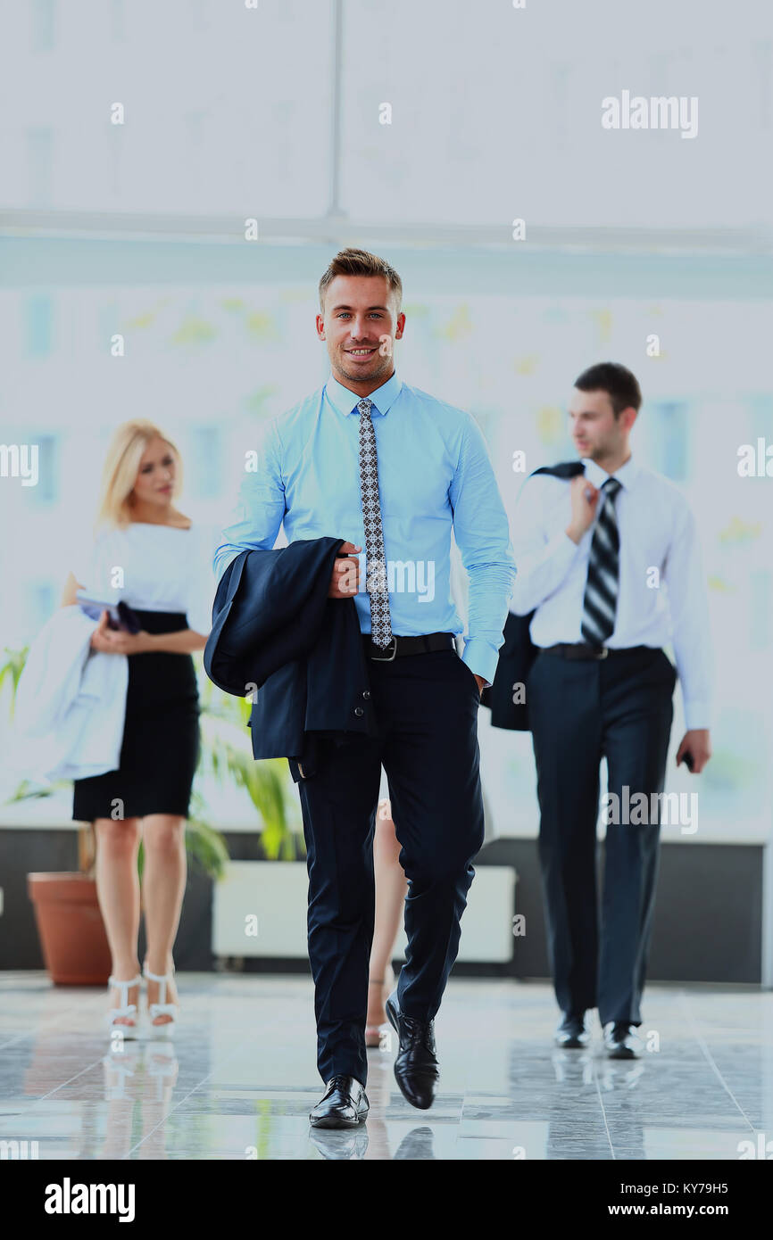 businesspeople group walking at modern bright office interior Stock ...