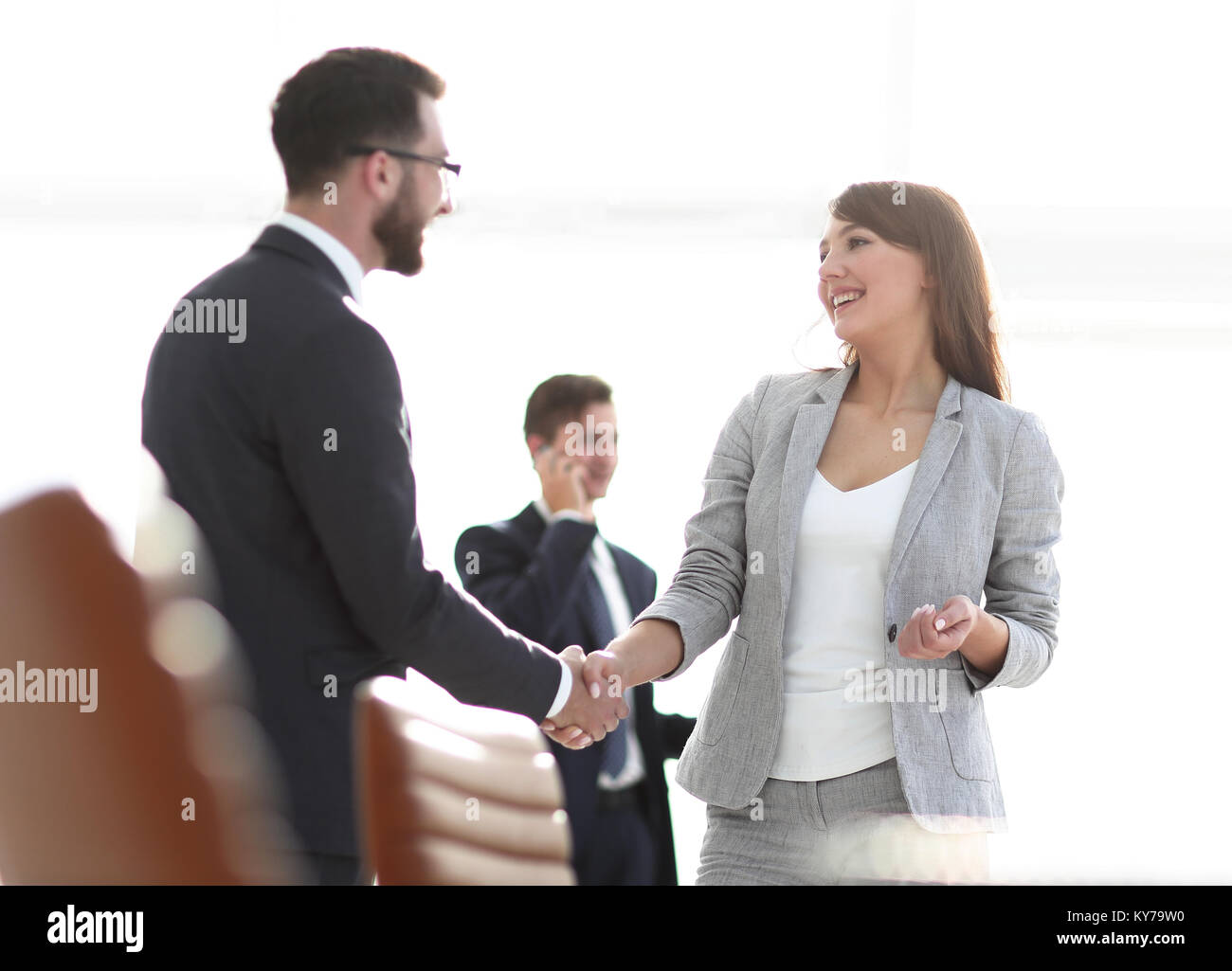 handshake between colleagues in the workplace Stock Photo - Alamy
