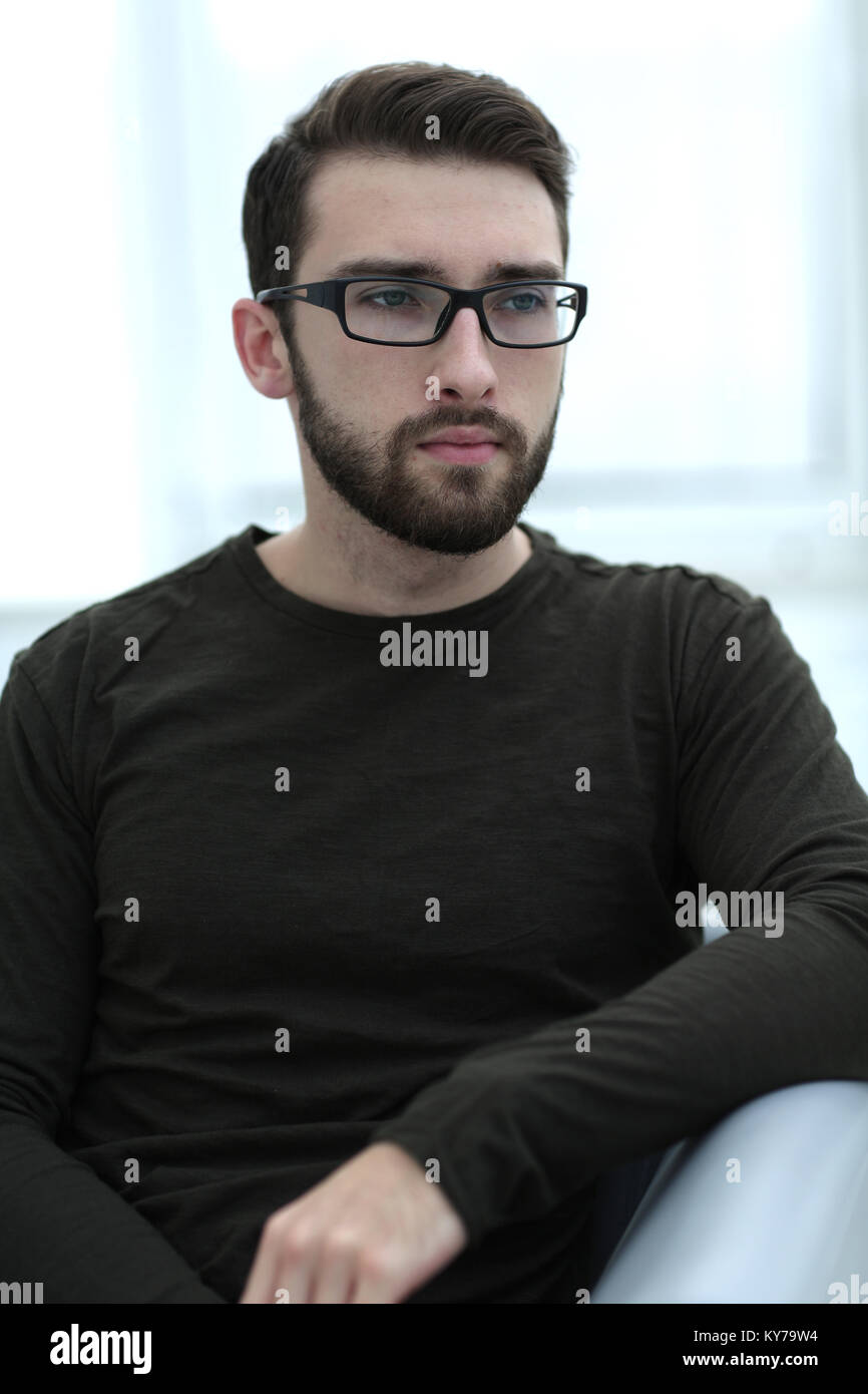 Pleasant guy is resting on sofa Stock Photo - Alamy