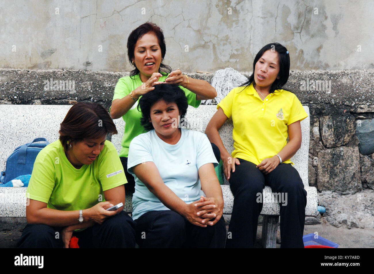 Thai girls on a break - Fishing port harbour - Hua Hin - Thailand Stock ...