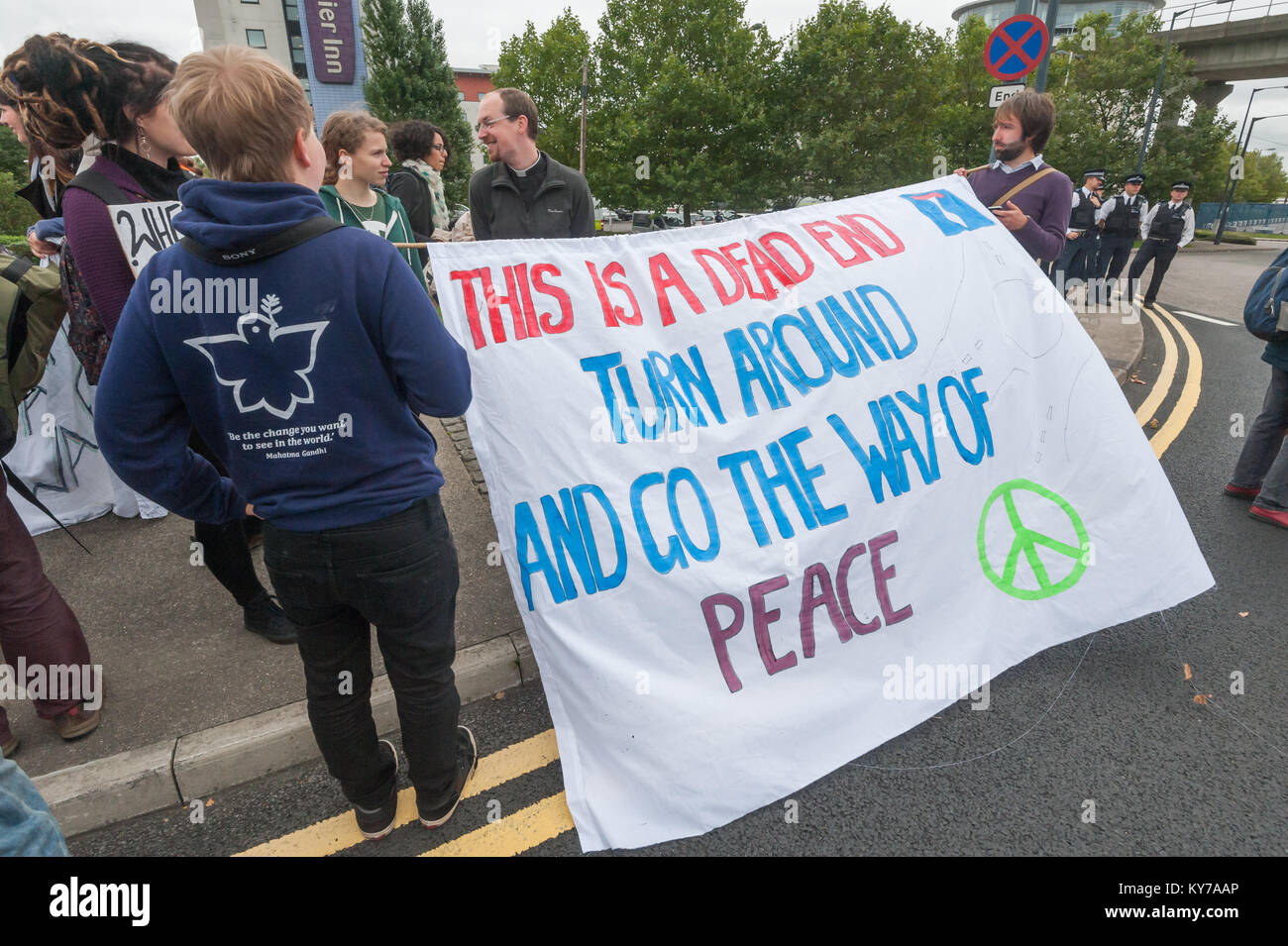 Campaigners hold a banner 'This is a Dead End - Turn around and go the ...