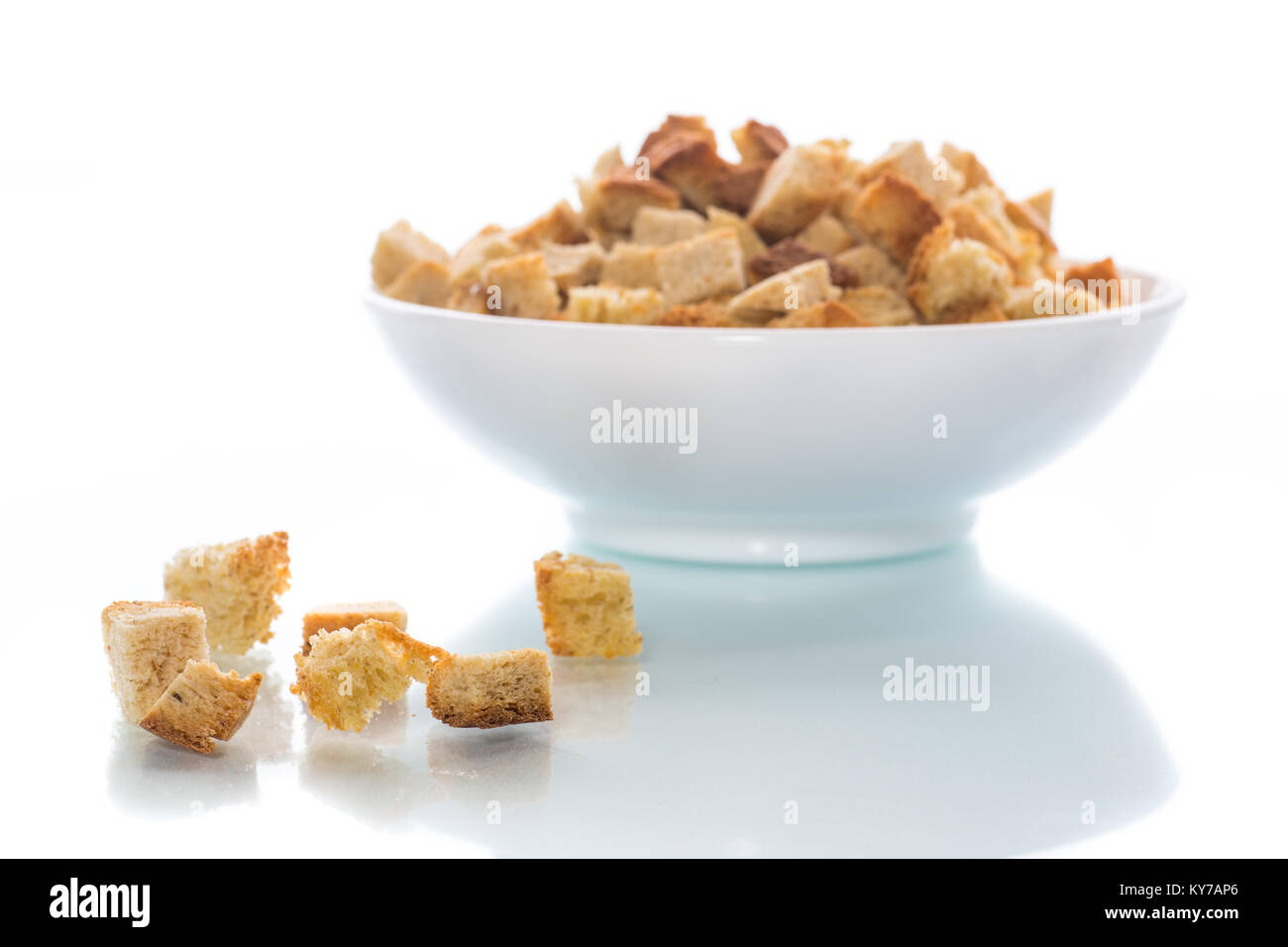 fried bread crumbs on a white background Stock Photo - Alamy