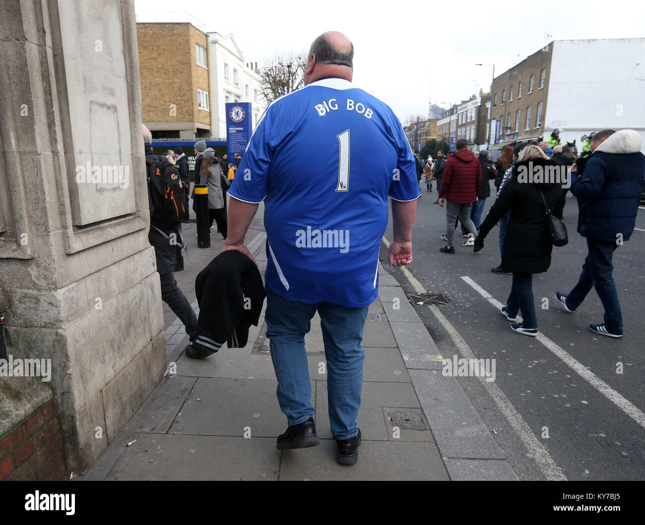 A Chelsea fan arrives at the ground prior to the Premier League match ...