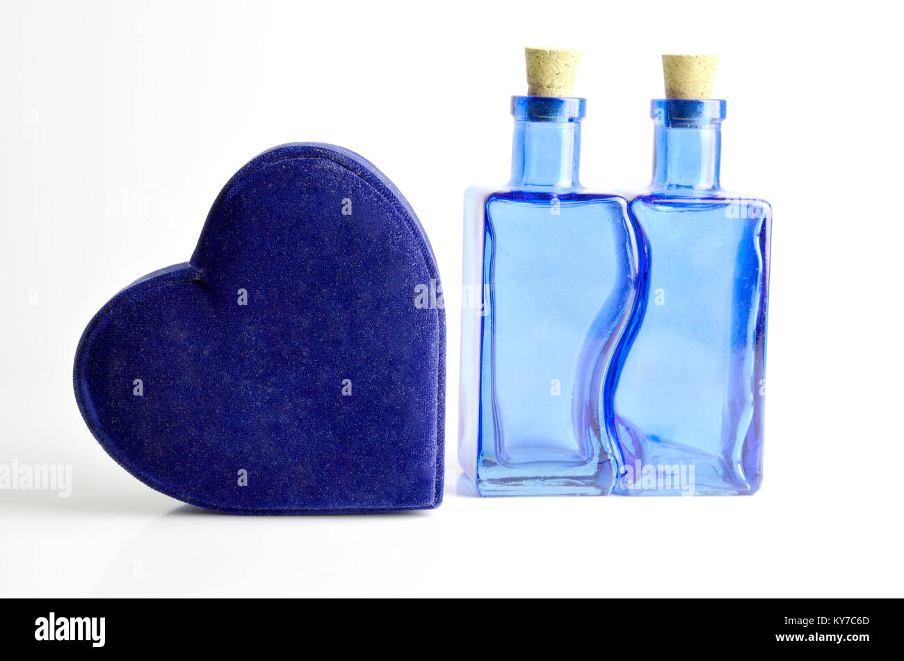 Love concept of a blue heart and two bottles Stock Photo - Alamy