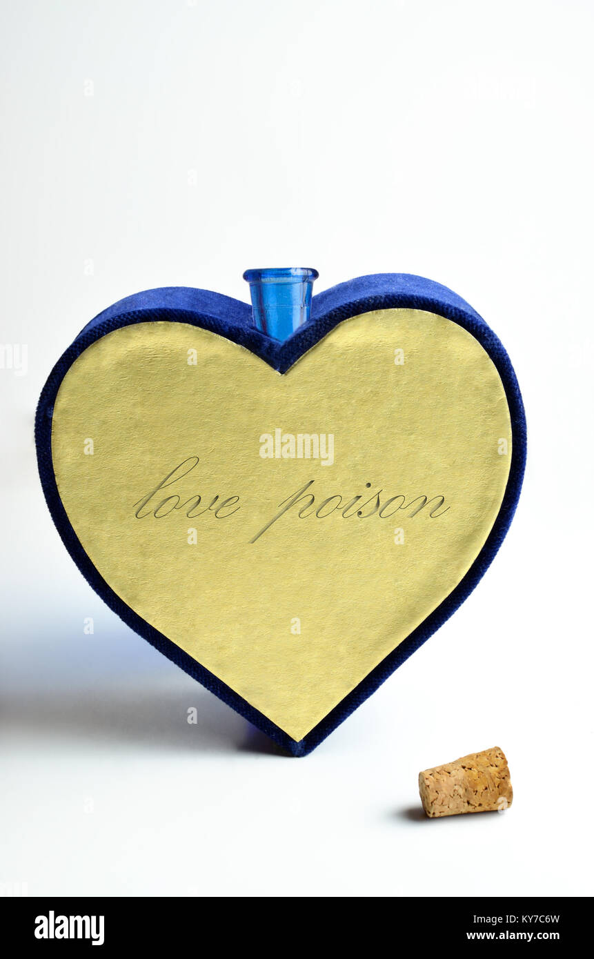 Love poison concept with an open gold and blue heart shaped bottle ...