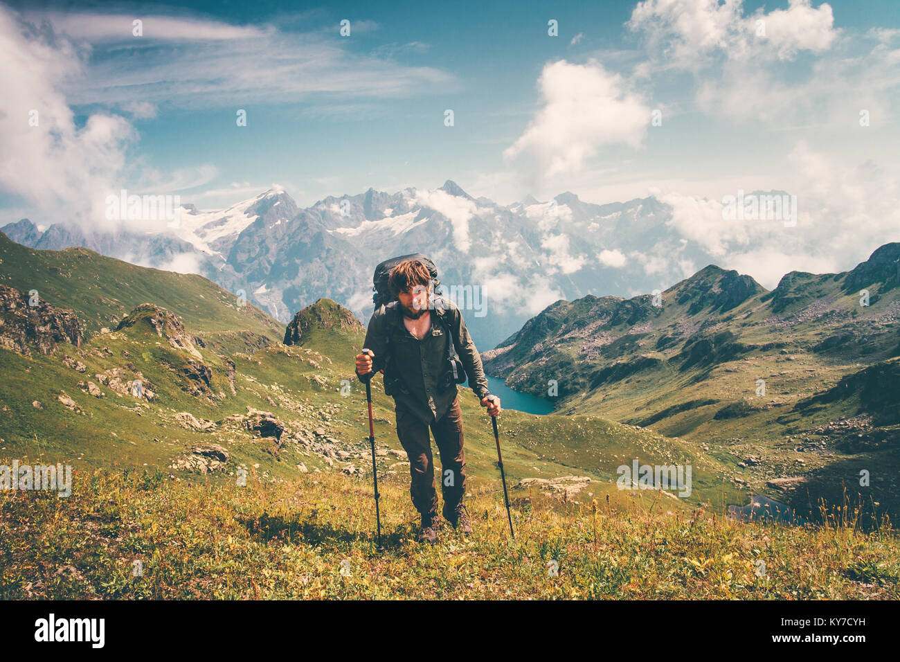 Traveler Man hiking Travel Lifestyle concept cloudy mountains landscape ...