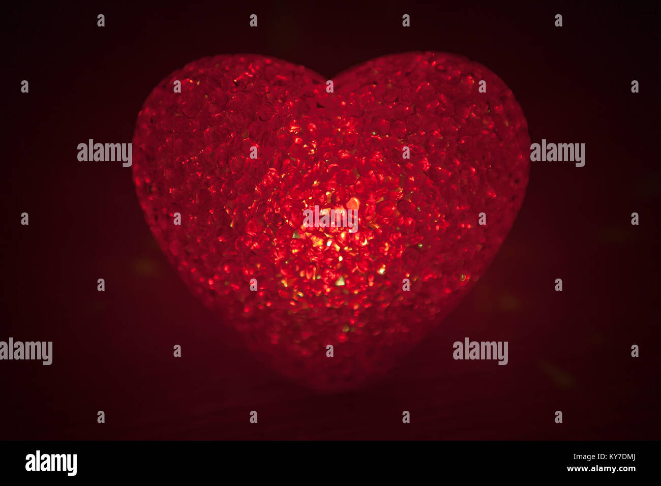 Red plastic light on dark wooden background Stock Photo - Alamy