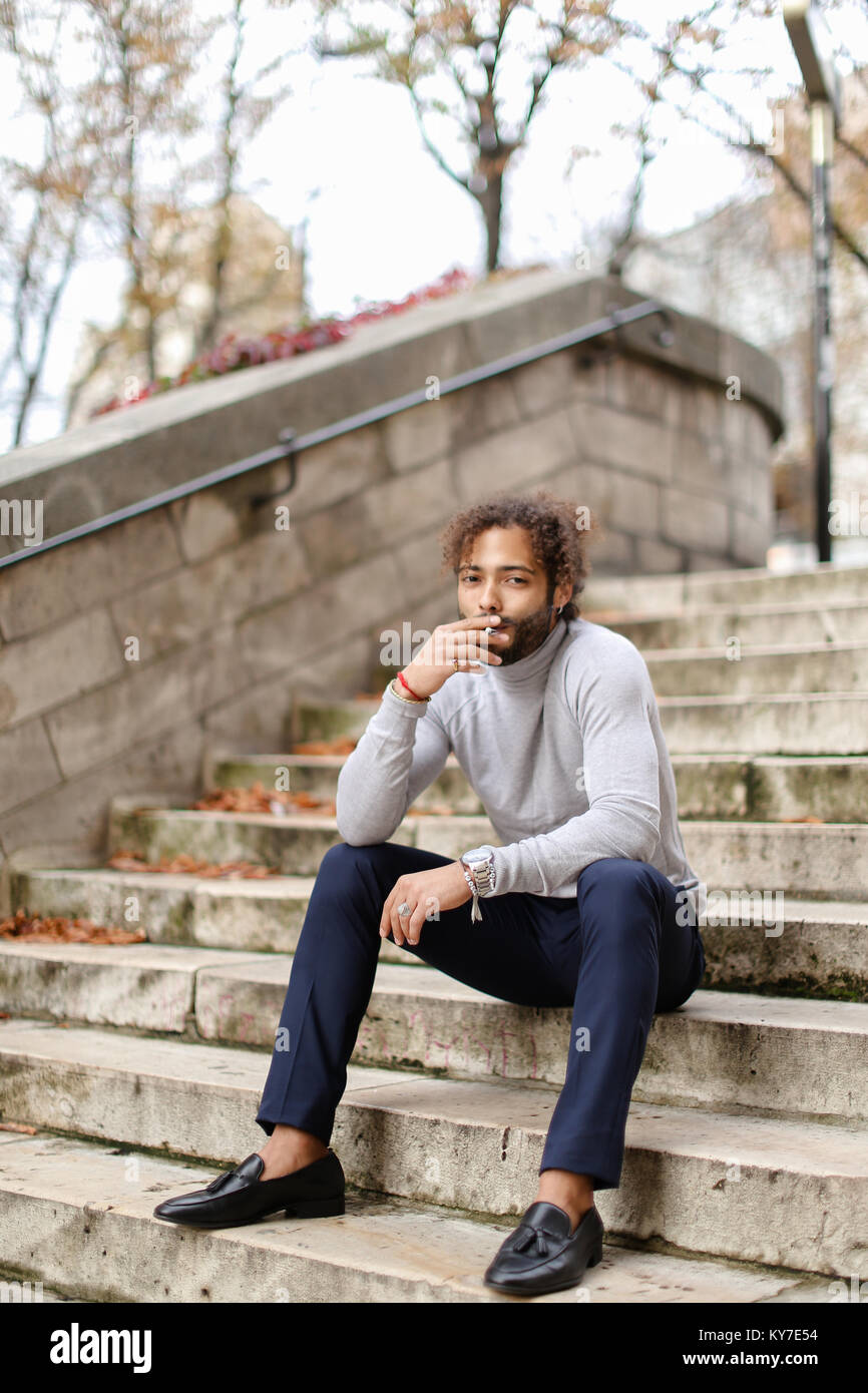 Close up face male person smoking on steps Stock Photo - Alamy