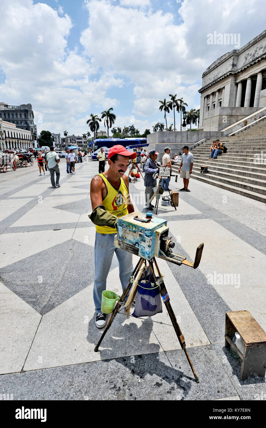 HAVANA, CUBA, MAY 11, 2009. A man with an old box camera in front of El ...