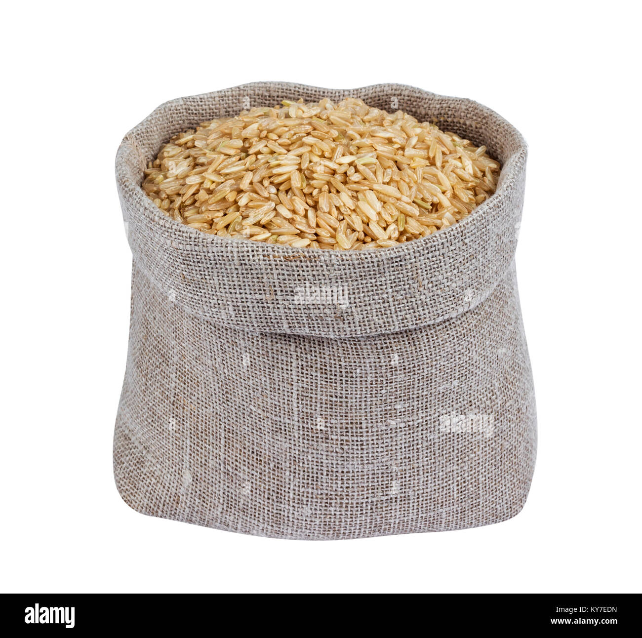 Brown rice in bag isolated on white background Stock Photo - Alamy