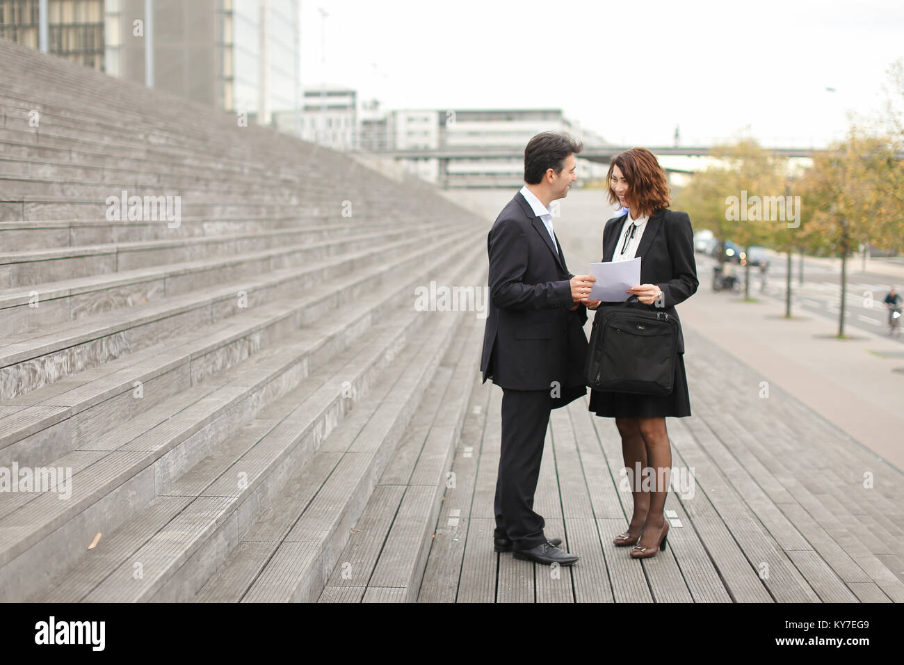 male lawyer speaking with female client Stock Photo - Alamy