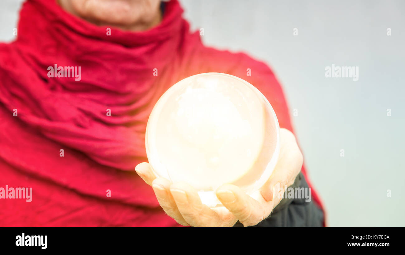 closeup of older womans hand holding a shiny glass sphere Stock Photo ...